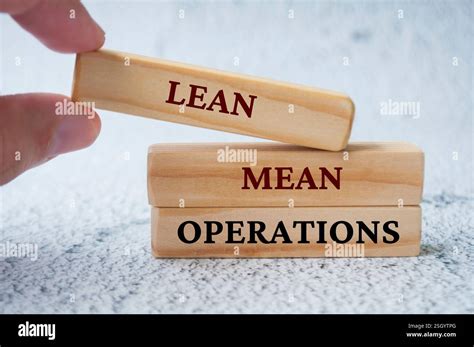 Lean And Mean Operation Text On Wooden Blocks Process Improvement