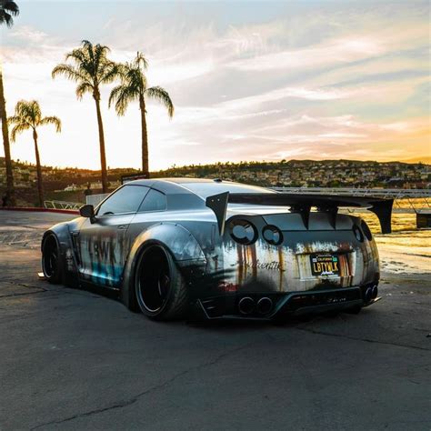 Nissan Skyline Gtr A Silver Sports Car At Sunset