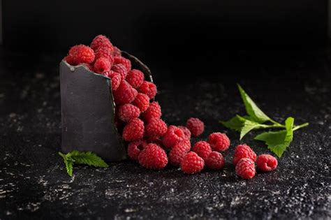Premium Photo Fresh Sweet Raspberry In Black Cup