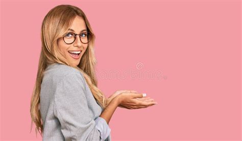 Beautiful Blonde Young Woman Wearing Business Clothes Pointing Aside