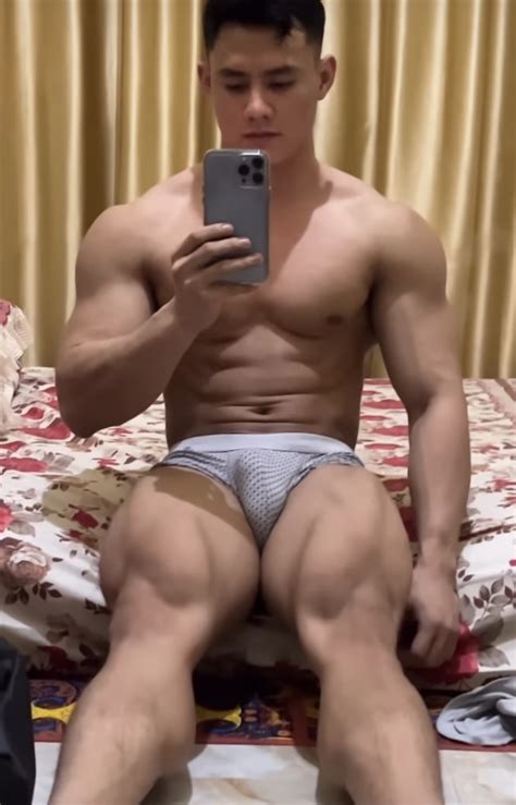 Muscle Guy Flexing On Bed