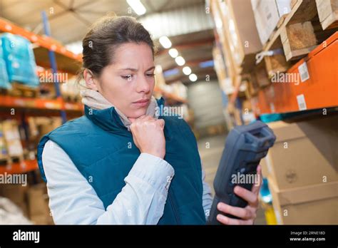Female Warehouse Worker Scanning Box In Warehouse Stock Photo Alamy