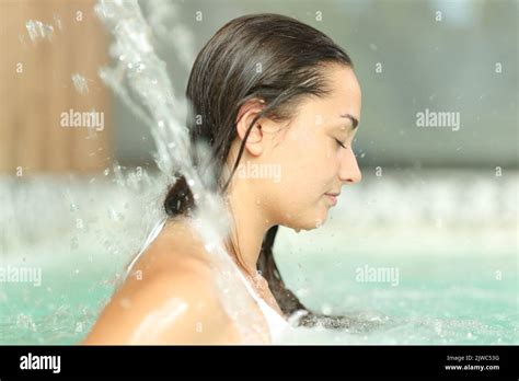 Profile Of A Woman With Closed Eyes Under Water Jet In Spa Pool Stock