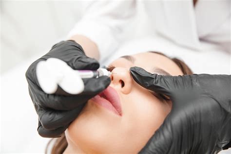 Premium Photo A Cosmetologist Gives A Nose Injection To Fix The Hump