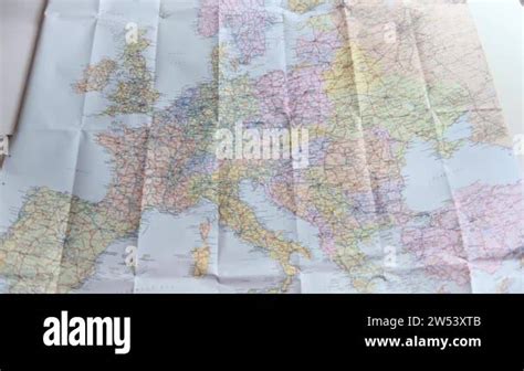 Passports And Various Currencies In A Plastic Bag Being Thrown On A