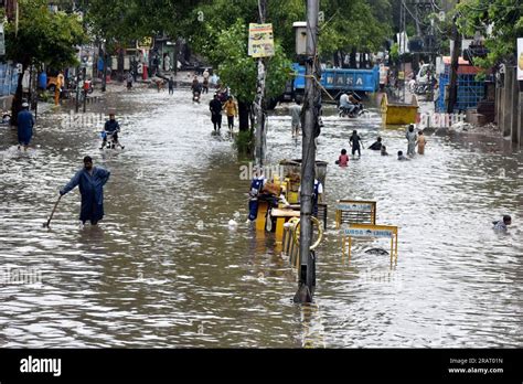 Lahore Pakistan 5th July 2023 People Wade Through Flooded Water