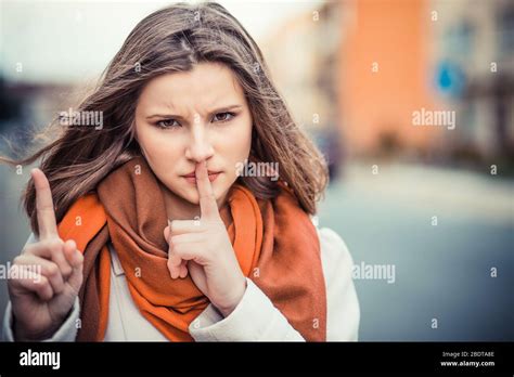 Woman Asking For Silence Or Secrecy With Finger On Lips Hush Hand