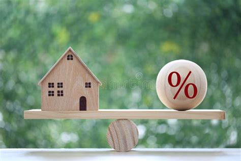 Interest Rate Up And Banking Concept Model House With Percentage