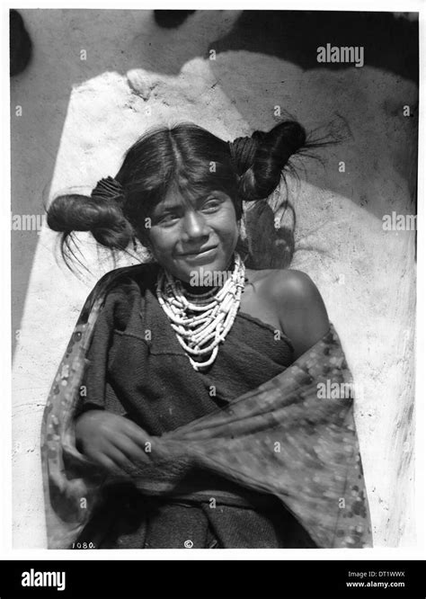 A Hopi Indian Maiden Standing In The Village Of Shonguapavi Around 1901