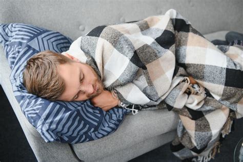 Sick Man Lying On Sofa At Home Stock Photo Image Of Home Health
