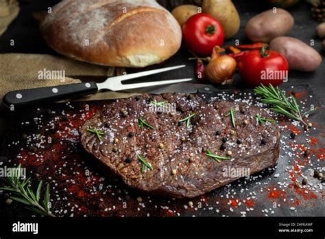 Beef Steak Seasoned With Salt Pepper And Fresh Hearbs Searved In The