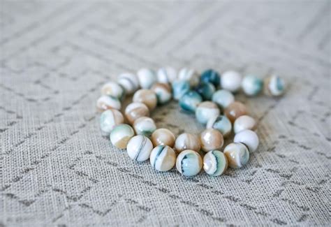 Premium Photo Striped Beads On A String With A Selective Focus