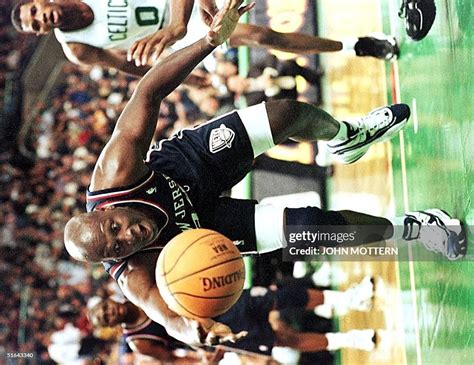 Xavier Mcdaniel Of The New Jersey Nets Chases A Loose Ball As Walter