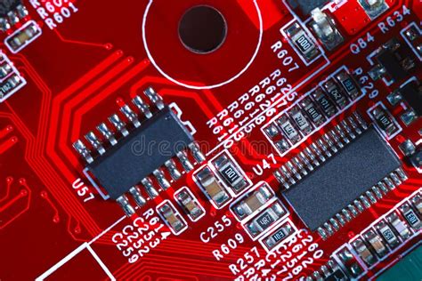 Closeup Of Red Electronic Motherboard Circuit With Processor Stock