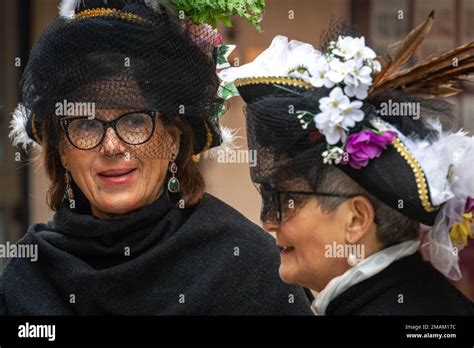 Two Adult Women In Black Medieval Carnival Costumes In Venice Stock