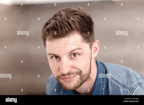 Portrait Of A Young Successful Man A Bearded Man In A Blue Shirt Stock