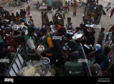 People Affected By Floods Receive Free Food In Flooded Areas In