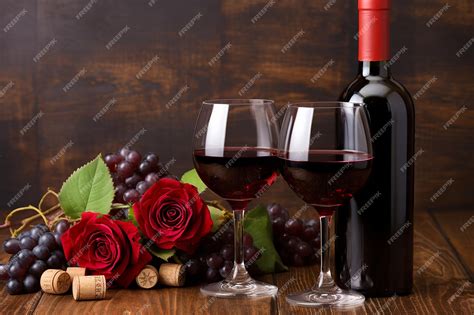 Premium Photo Red Wine And Flowers Romantic Table Arrangement