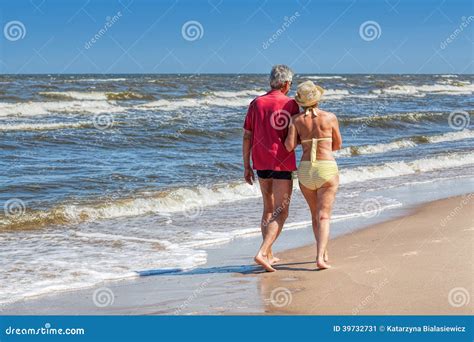 Couple Strolling At Coastline Stock Image Image Of Horizon Sand