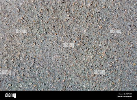 Close Up Macro View Of Gray Volcanic Sand And Small Stone Surface