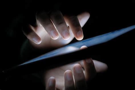 Premium Photo Hacker Stealing Data From Digital Tablet Closeup