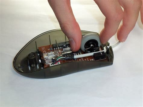 Removing The Logitech MBJ58 Mouse Scroll Wheel IFixit