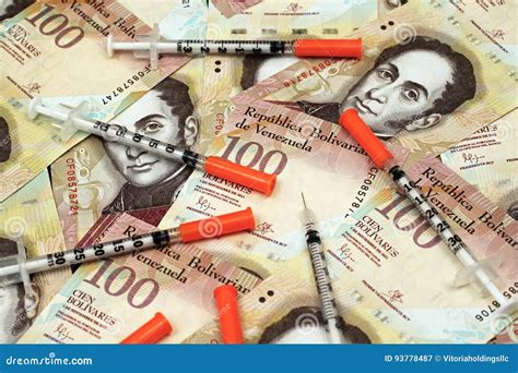 Venezuelan Currency Close Up With Hyperdermic Needles Stock Image