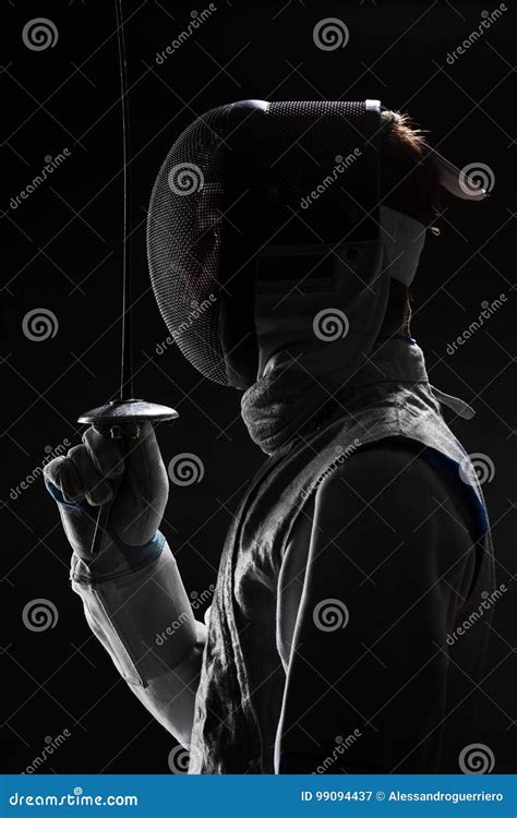 Male Fencer With Mask Holding The Sword In Front Of His Stock Image
