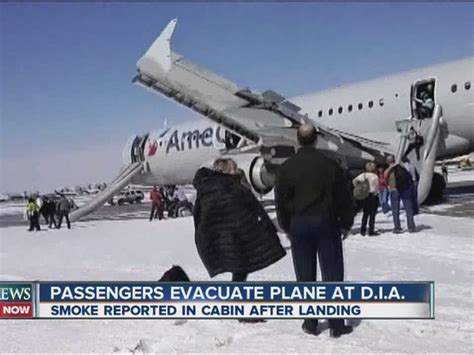 Passengers Use Emergency Slides After Landing