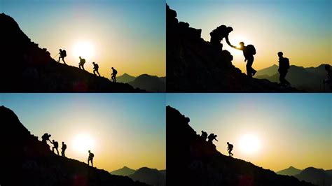 团队手拉手登山剪影团队精神攀登顶峰攀登者视频素材下载