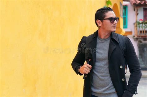 Portrait Of A Handsome Latin Hipster Walking Down The Street Lifestyle
