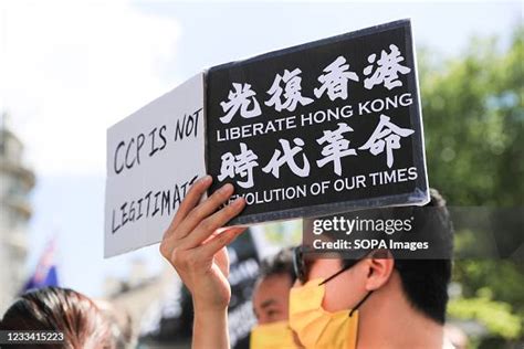 A Pro Democracy Activist Holds Placards Saying Liberate Hong Kong