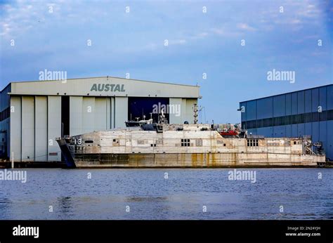 The Usns Apalachicola Epf 13 Is Docked Outside Austal Usas Shipbuilding Facility On The