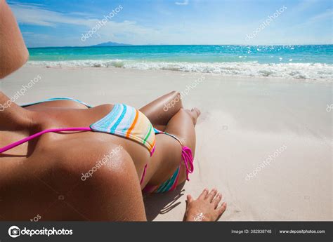Ladies Tanning On The Beach
