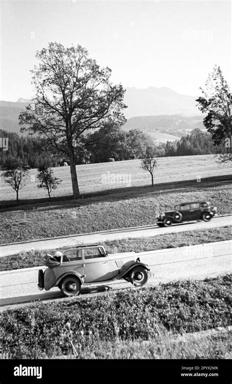 In This Photo The Photographer Captures Two Passing Cars The Cars Are
