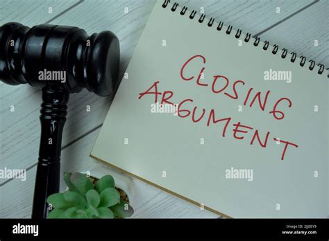 Concept Of Closing Argument Write On A Book With Gavel Isolated On Wooden Table Stock Photo Alamy