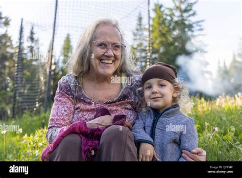 Closeup Joyful Portrait Of Elderly Smiling Grandmother With Arm Around