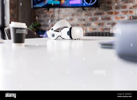 A Vr Headset Rests On An Office Table Indicating A Tech Savvy Casual