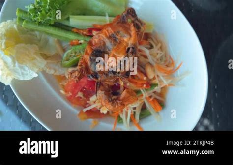 Thai Food Concept With Spicy Green Papaya Salad Fried Crab Green