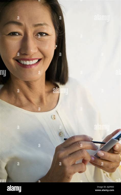 Woman Using PDA Portrait Stock Photo Alamy