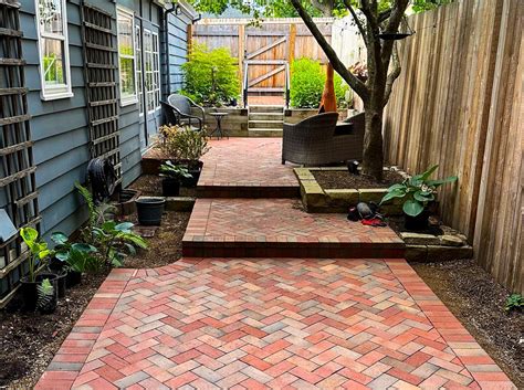 Jake” Of All Trades Rehabs A Narrow Sloping Courtyard With Terraced