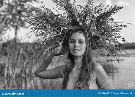 Beautiful Naked Young Woman With Wreath Have Fun In Water Stock Image