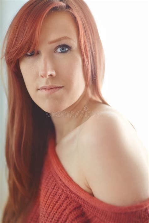 Portrait Of One Beautiful Young Redhead Woman Relaxing Home Confident