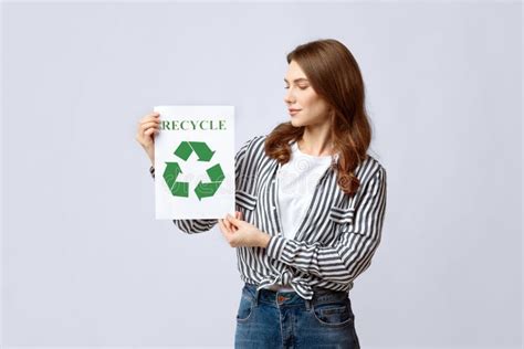 Motivational Placard With Green Recycle Sign In Hands Of Young Woman