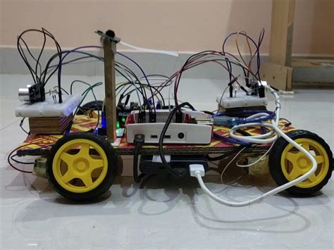 iot social distancing and monitoring robot for queue