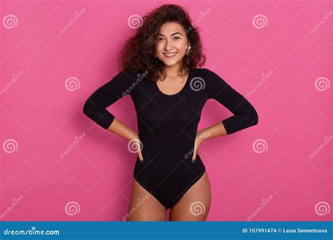 Close Up Portrait Of Young Beautiful Brunette Woman Wearing Black Combi