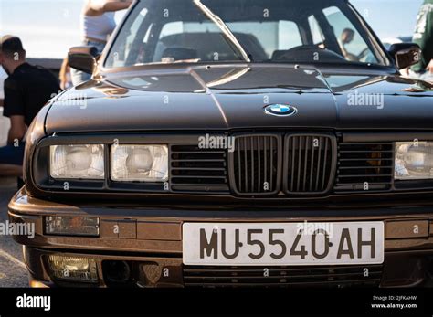 Beautiful Brown Bmw E30 With Square Headlights And An Open Hood Stance