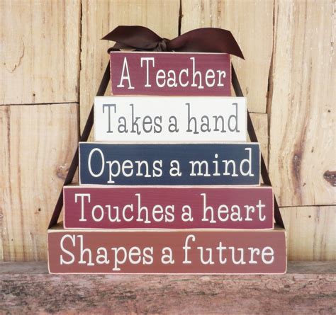 A Teacher Takes A Hand Opens A Mind Touches A Heart Shapes