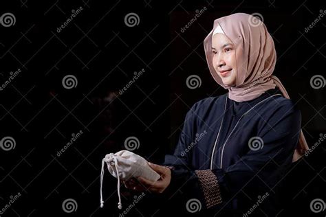 Hands Holding A Money Bag For Zakat Islamic Zakat Concept Muslims