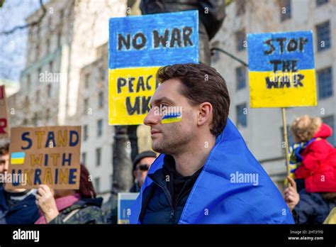 London Uk 26th Feb 2022 A Protester Has His Face Painted In Yellow